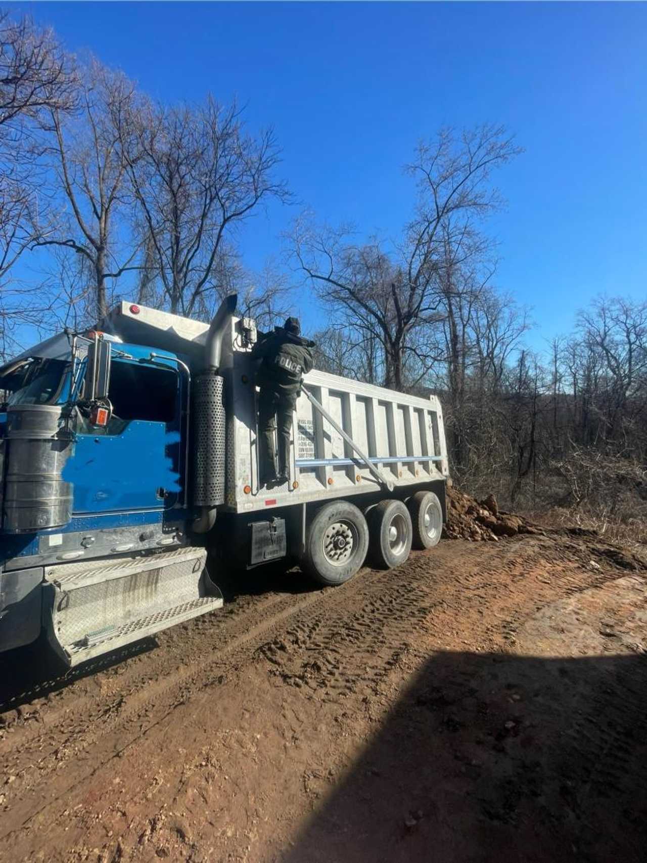 Not-So-Slick Move: Dump Truck Sinks In Mud After Unloading Illegal ...